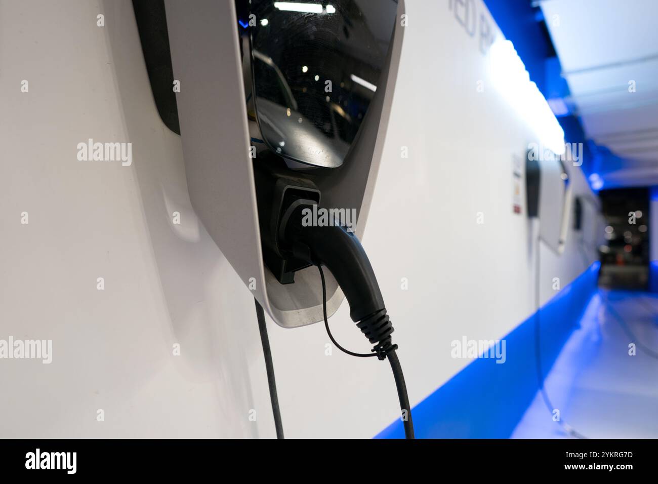 Electric Vehicle or EV Car parking at charging station and plugged ...