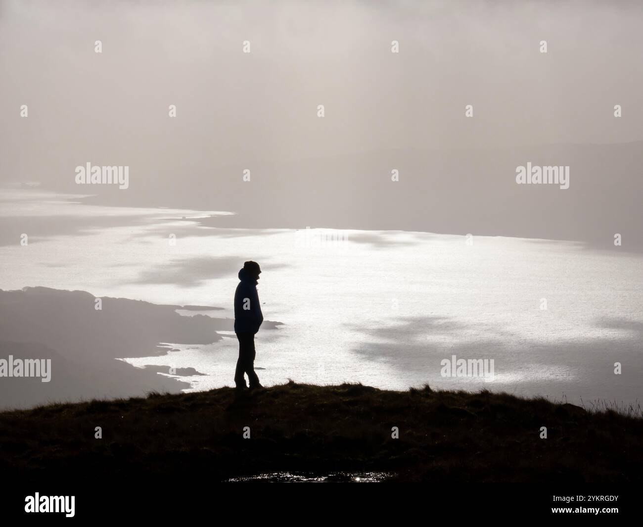Hill walkers on Ben Hiant, on Ardnamurchan looking over the sound of ...