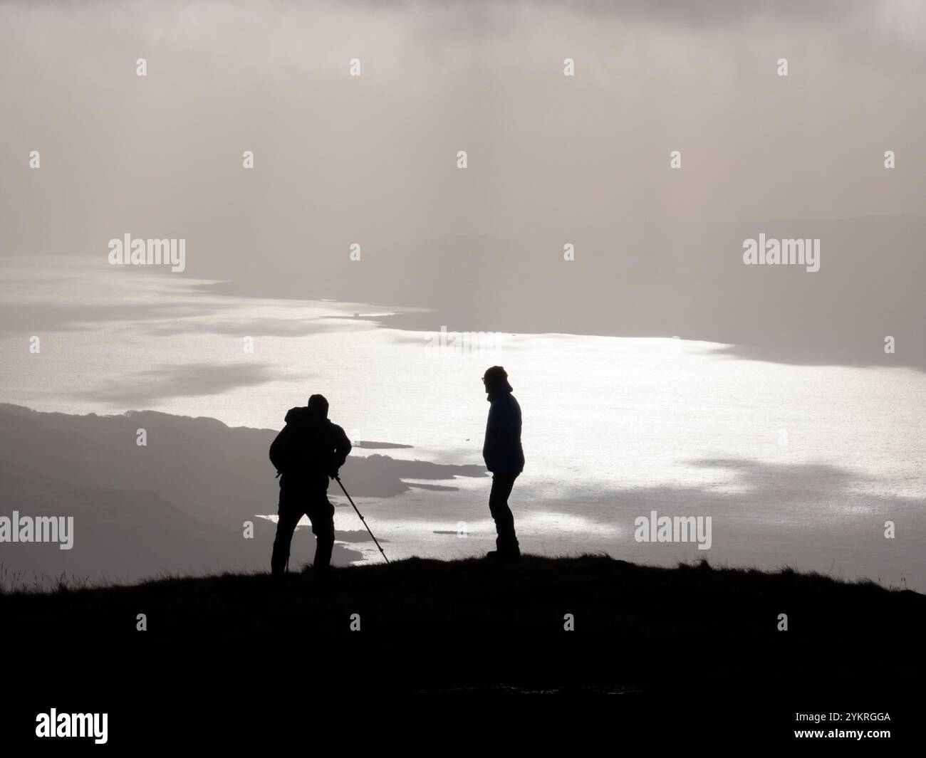 Hill walkers on Ben Hiant, on Ardnamurchan looking over the sound of ...