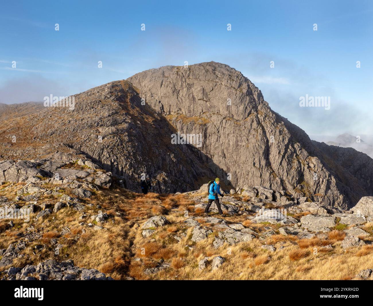 A hiker above cloud from a temperature inversion on Garbh Bheinn ...