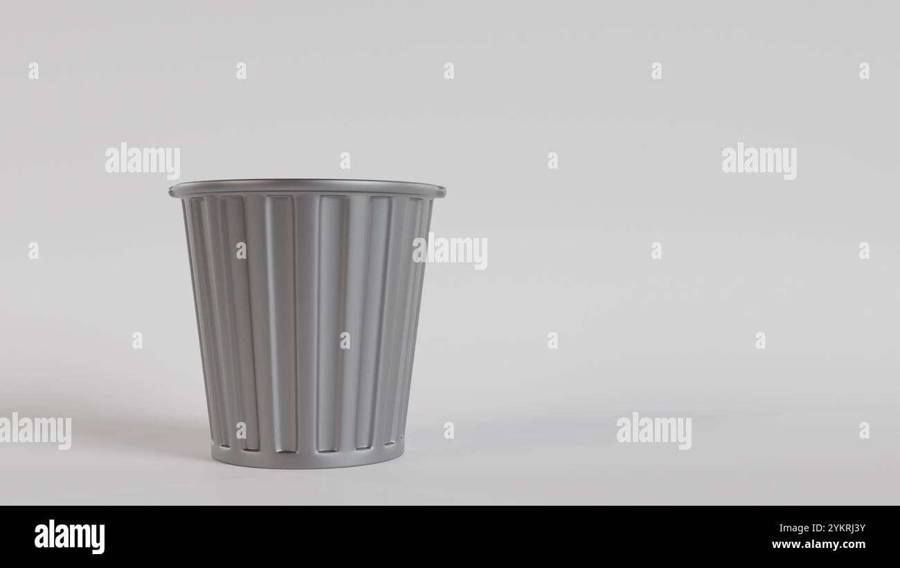 An empty metal trash can on a white background, representing simplicity ...