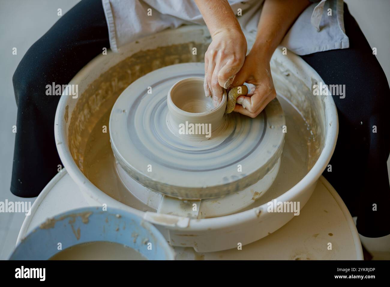 Engaging in Artisan Pottery Crafting Using a Wheel for Unique and ...