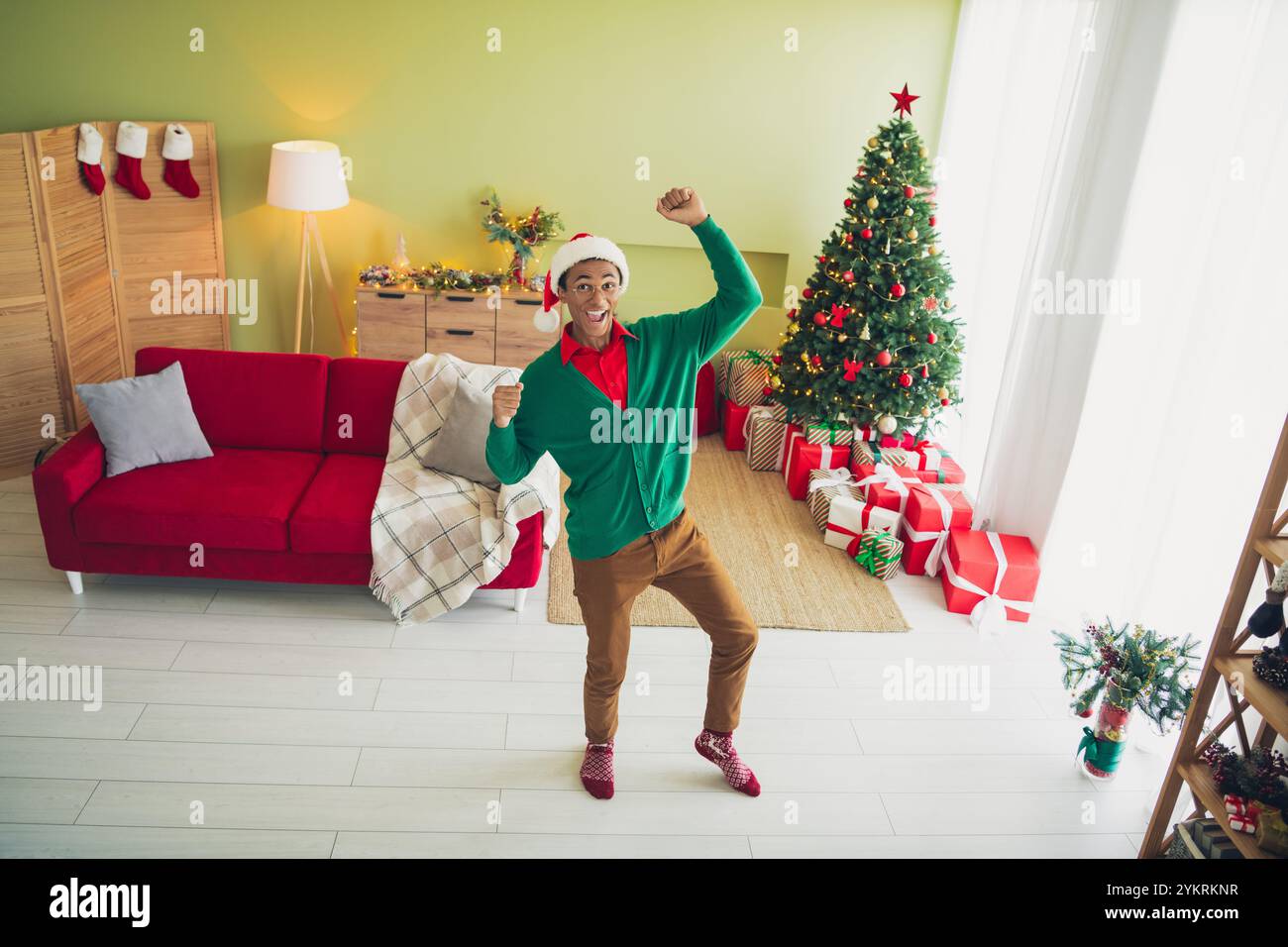 Full length photo of funky young mister dancing have fun dressed green ...