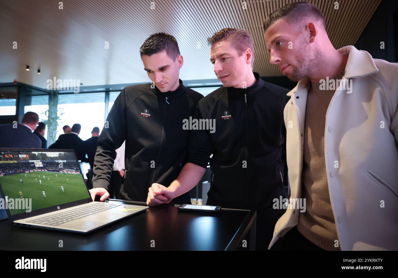 referee Brent Staessens, referee Lawrence Visser and Antwerp's Toby ...