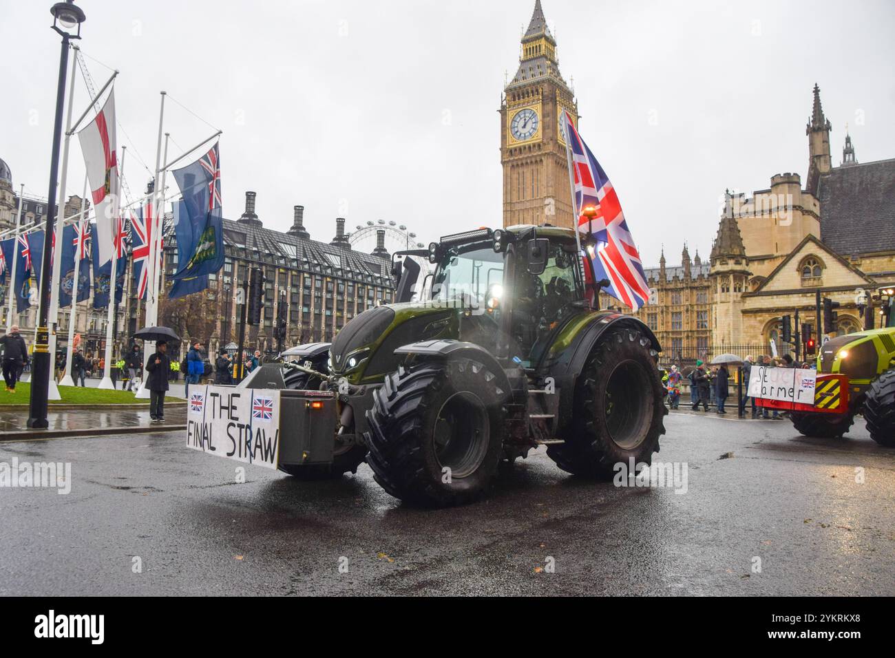London, UK. 19th November 2024. Tractors pass through Parliament Square ...