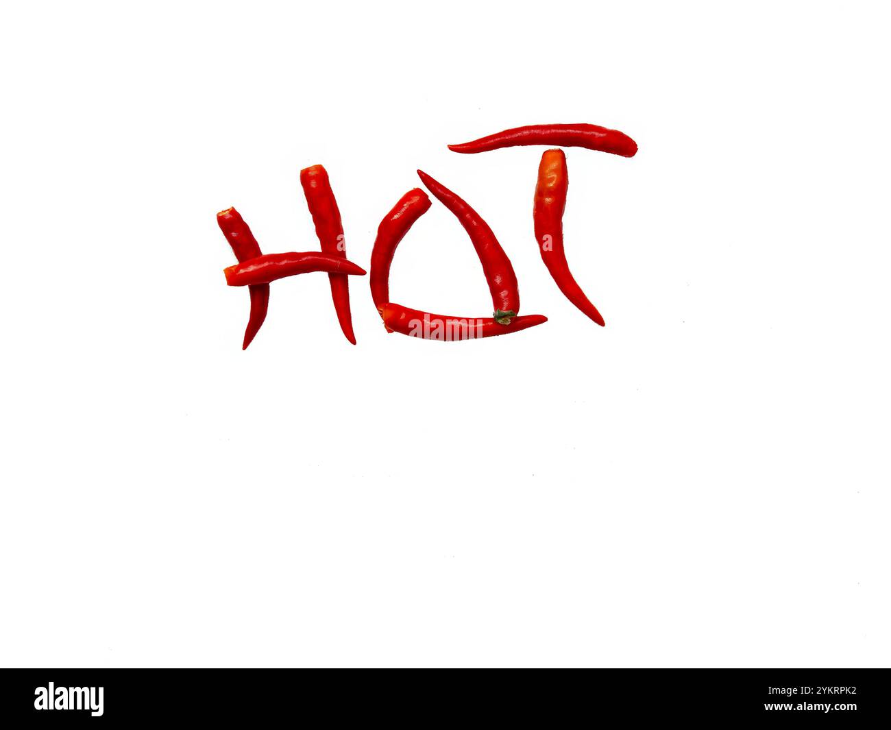 Red Chili Peppers with the word hot on a white background with copy ...