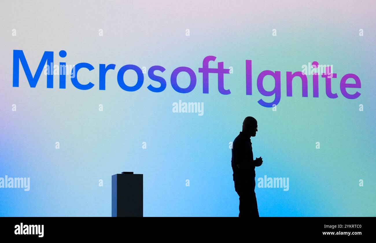 Microsoft CEO Satya Nadella stands in silhouette during the Microsoft Ignite conference Tuesday ...