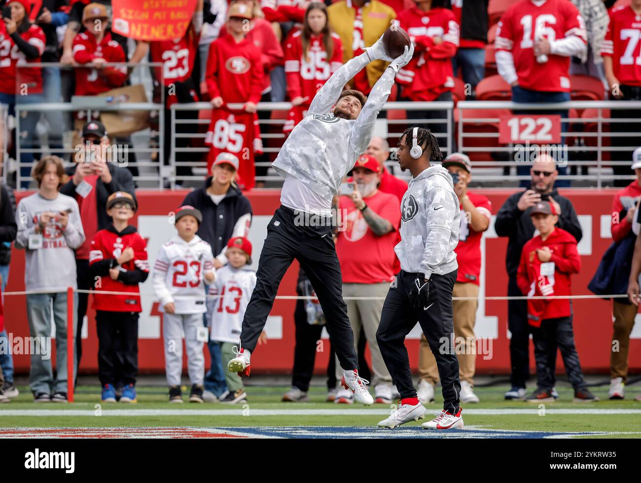 Ricky Pearsall (14) makes a leaping catch during warmups before the San ...