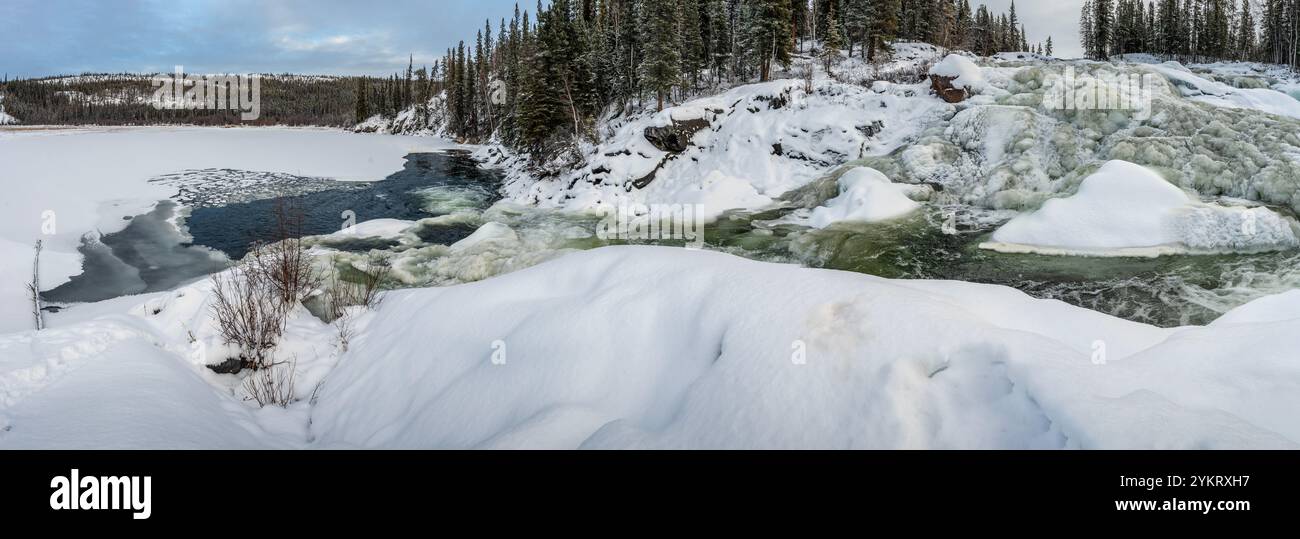 Winter view of the frozen Cameron River Rampart Falls near Yellowknife ...