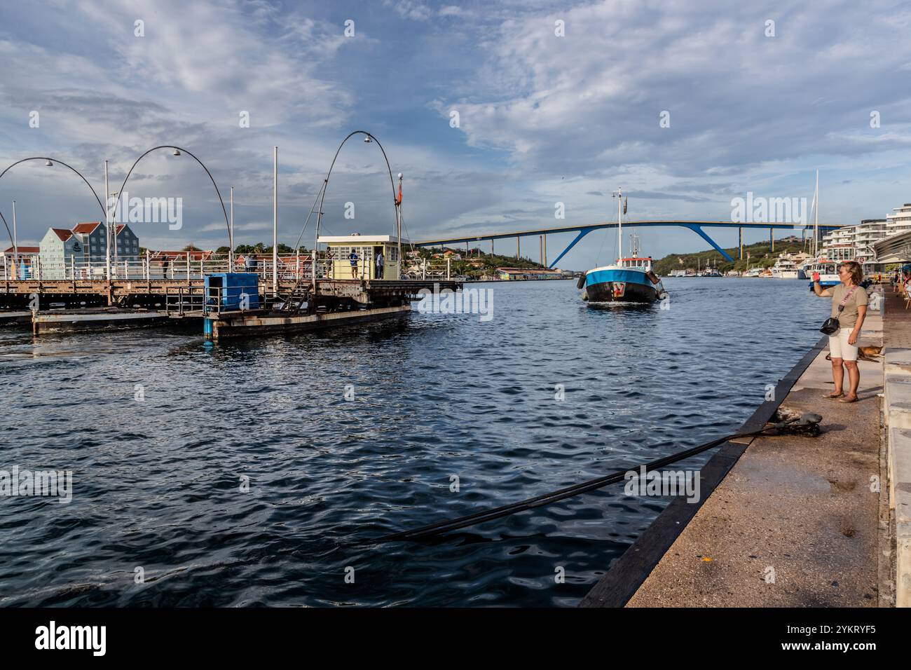 The Queen Emma Bridge is called the Swinging Old Lady. This 1888 ...
