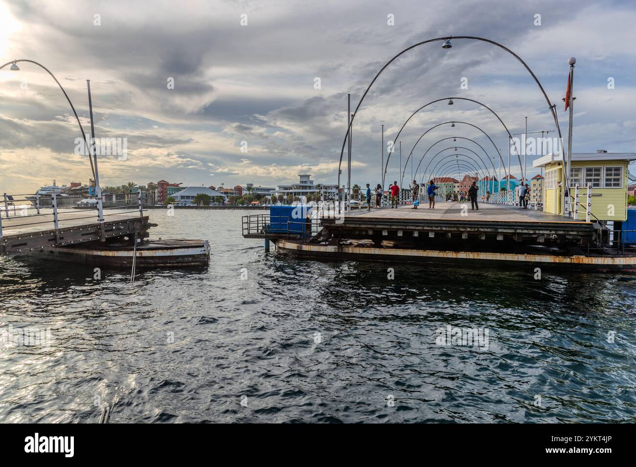 When the Queen Emma Bridge opens for ships, pedestrians are allowed to ...