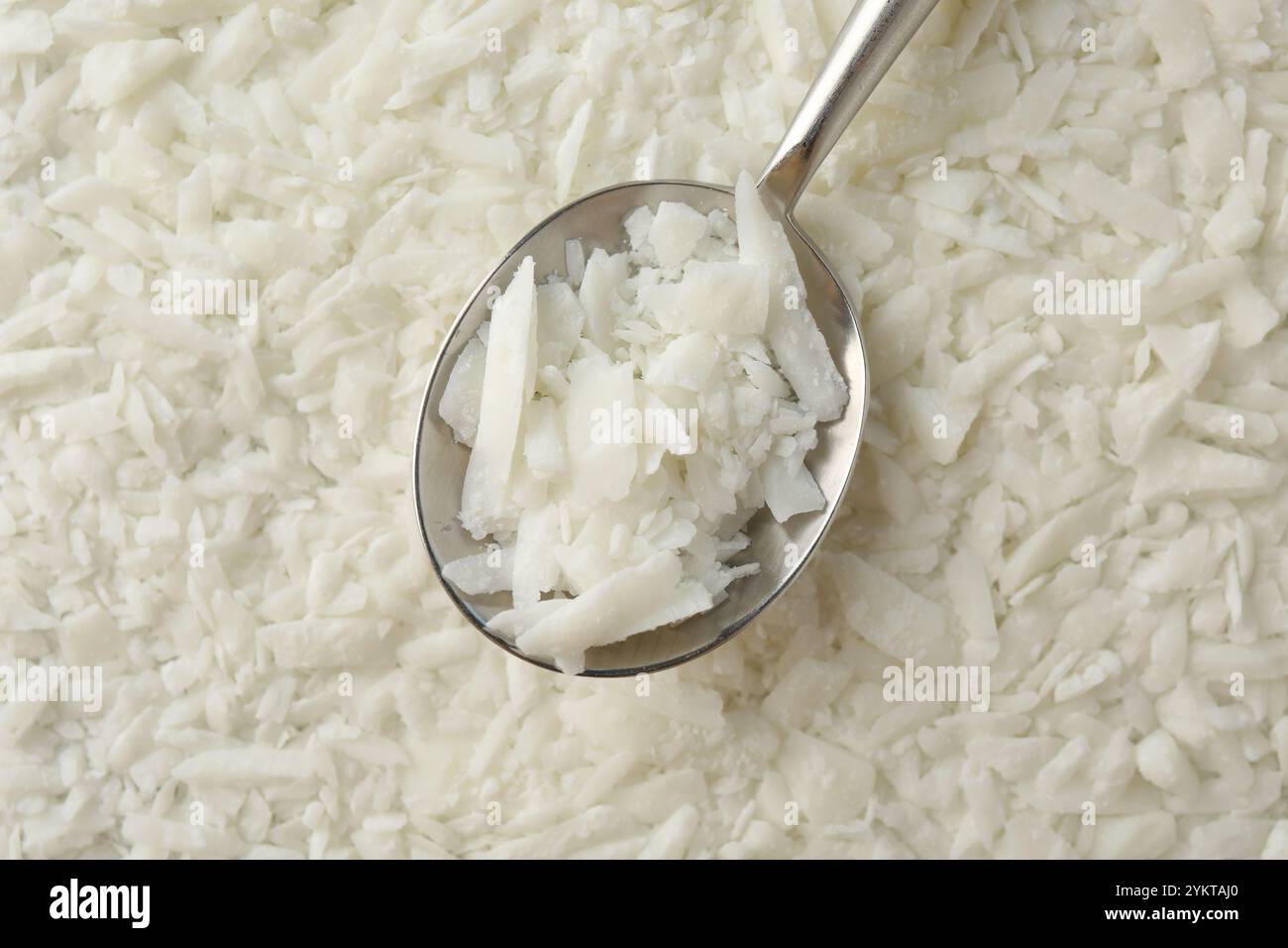 Soy wax in spoon on pile, top view Stock Photo - Alamy