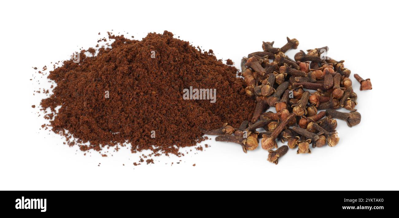 Pile of clove powder and dried buds on white background. Aromatic spice ...