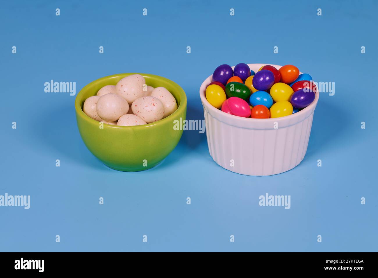 Chewing gum balls of different colors in shiny earthenware containers ...