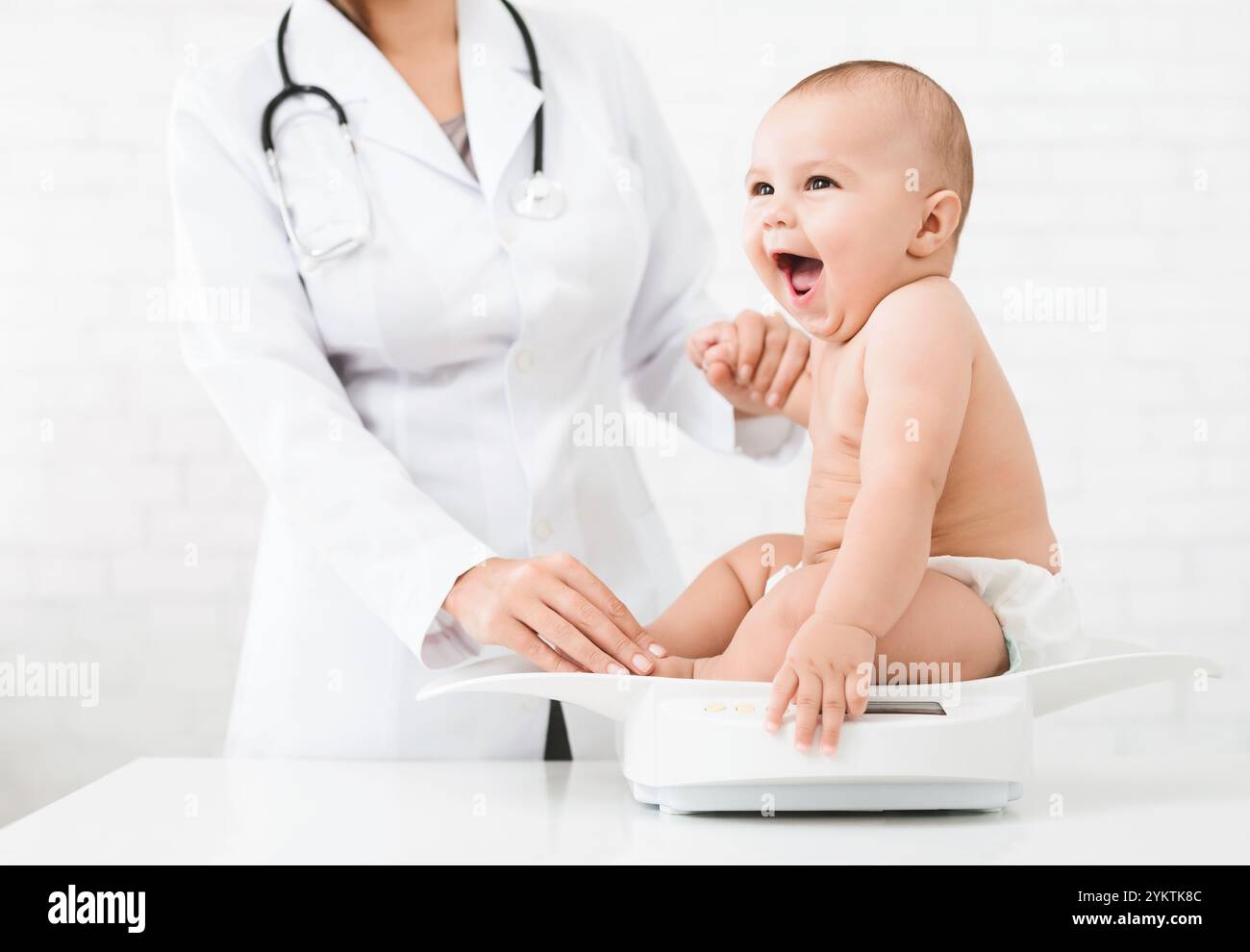 Adorable little baby child with female pediatrician Stock Photo - Alamy