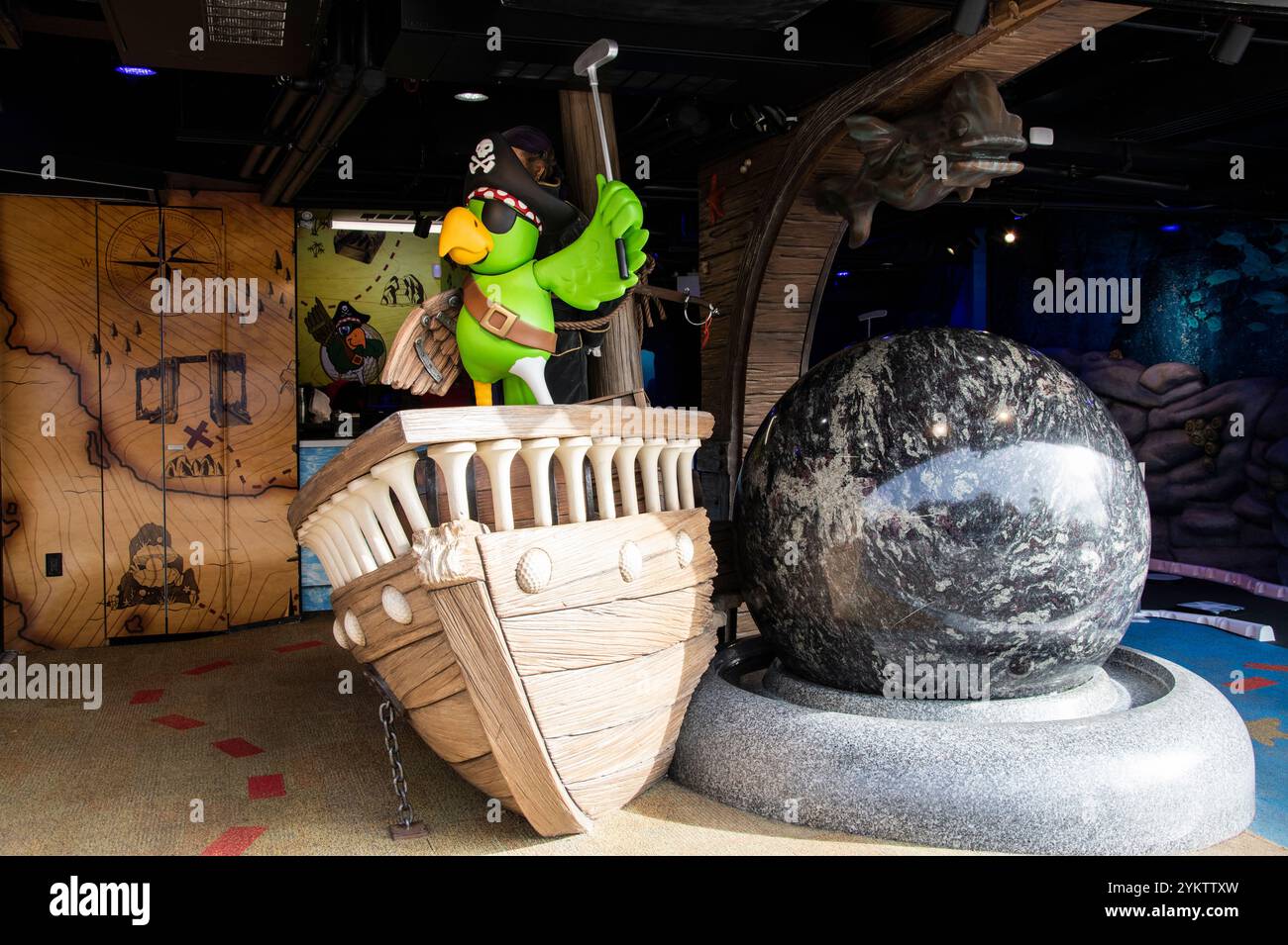 Green parrot and granite sphere water feature at Pirate Putt on Clifton ...