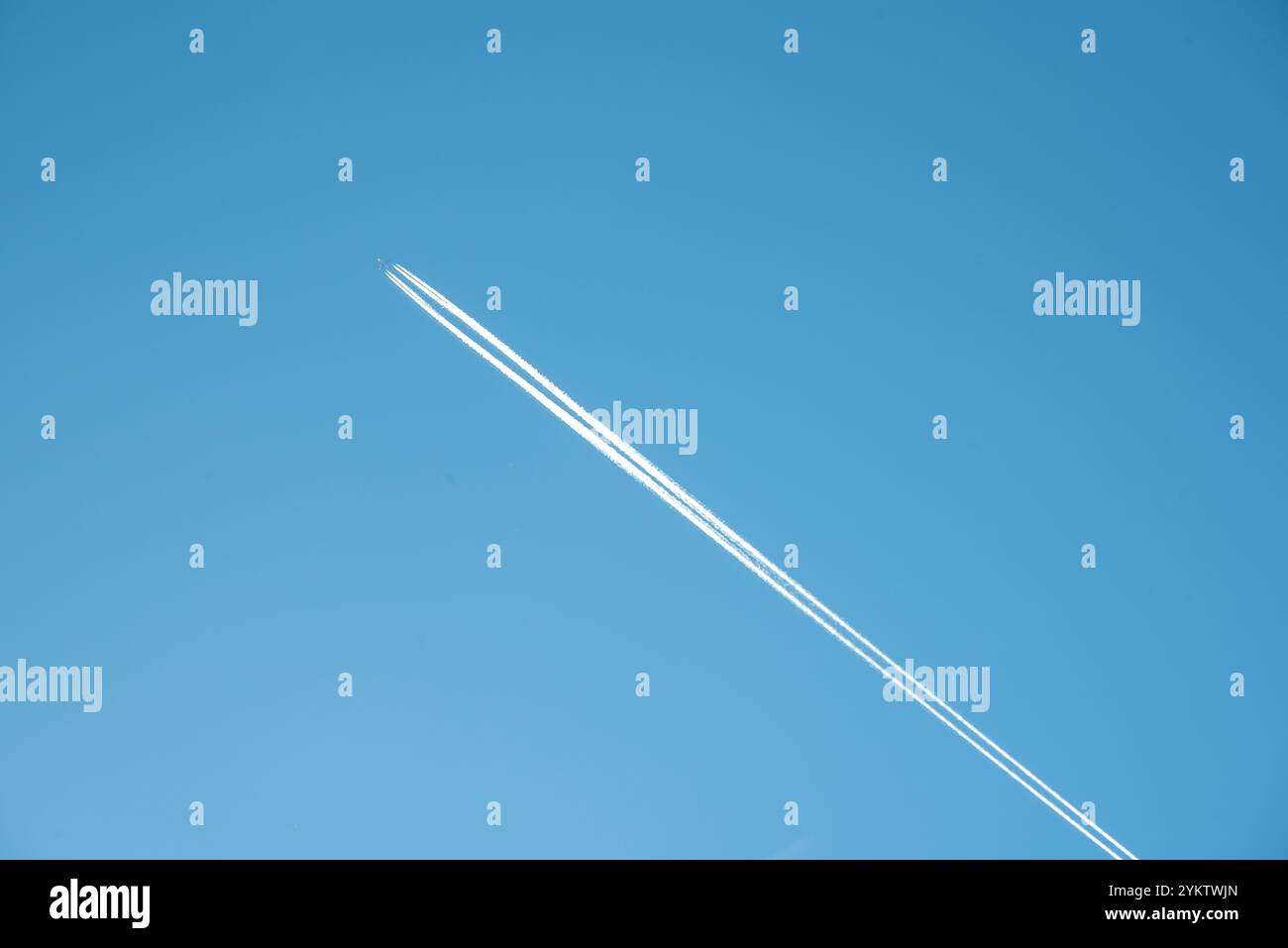 Perfectly stunning blue sky day with air stream from aeroplane airplane ...