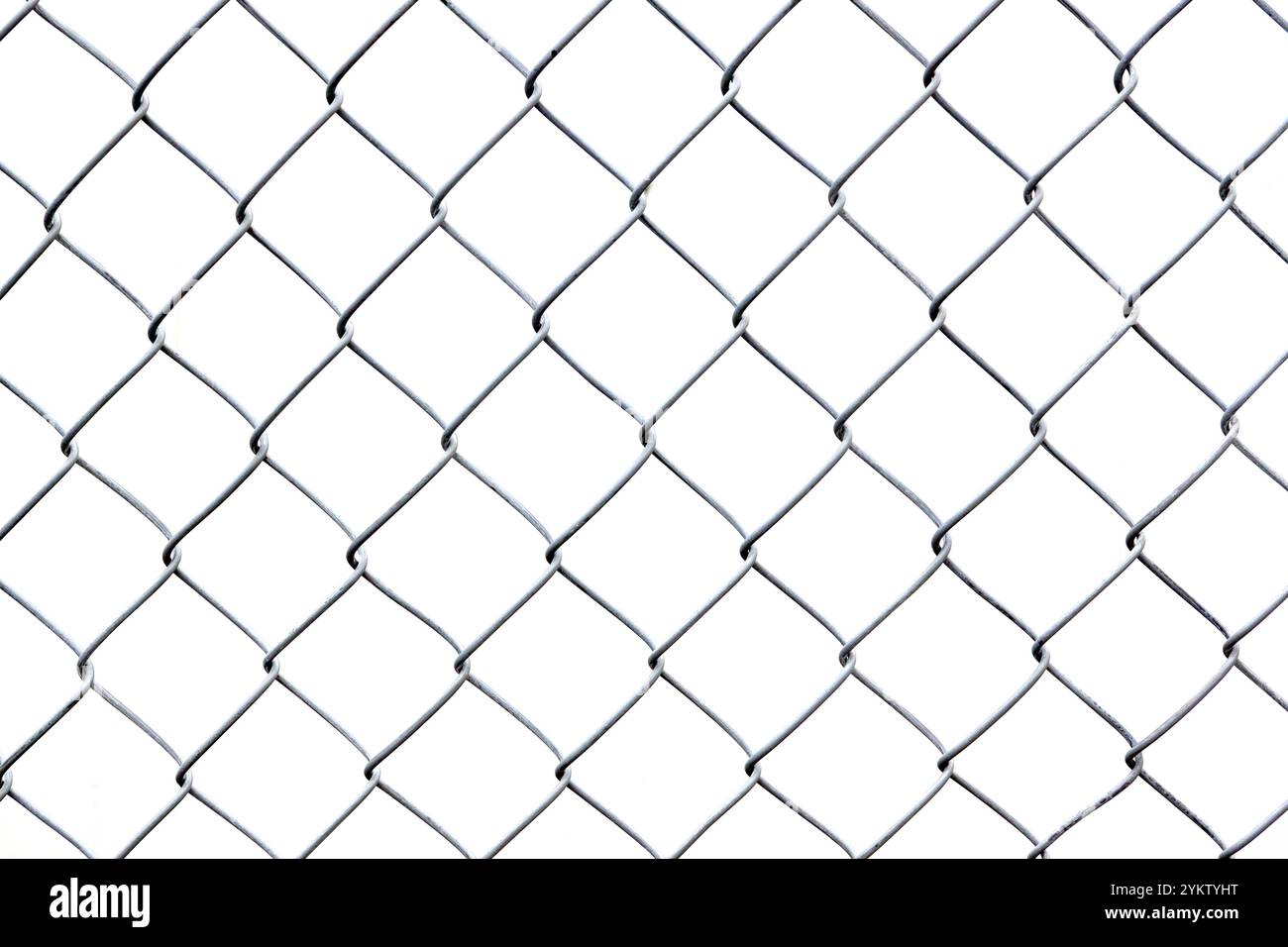 The repeating daimond patterns of a chain-link fence with a white ...