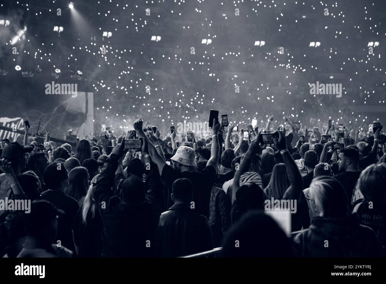 The crowd holding up cell phones in tribute to Bray Wyatt at AEW All In ...
