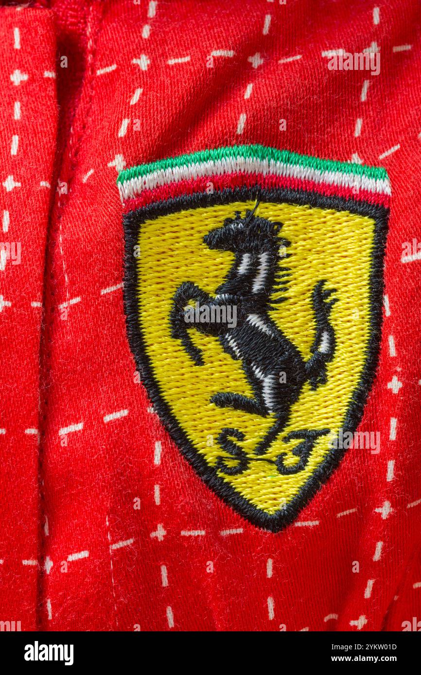 Scuderia Ferrari logo badge on racing overalls worn by teddy bear soft ...