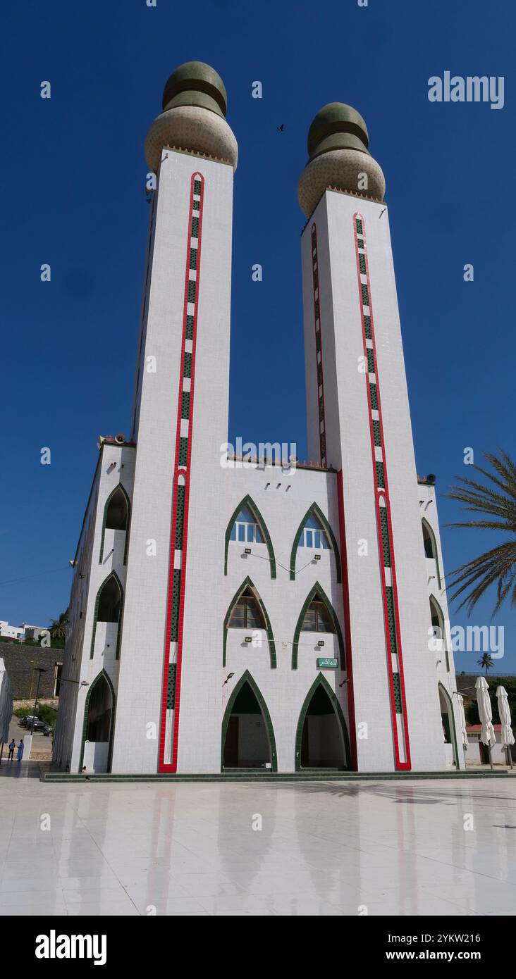 Divinité mosque with two minarets decorated with red patterns and ...