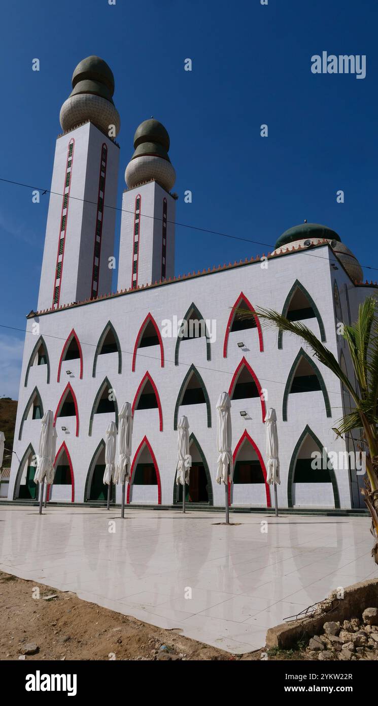 Divinité mosque with two minarets decorated with red patterns and ...