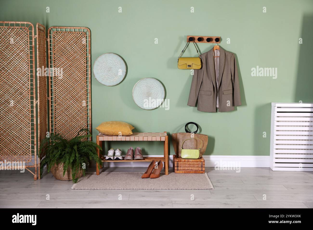 Stylish hallway interior with bench and folding screen Stock Photo - Alamy