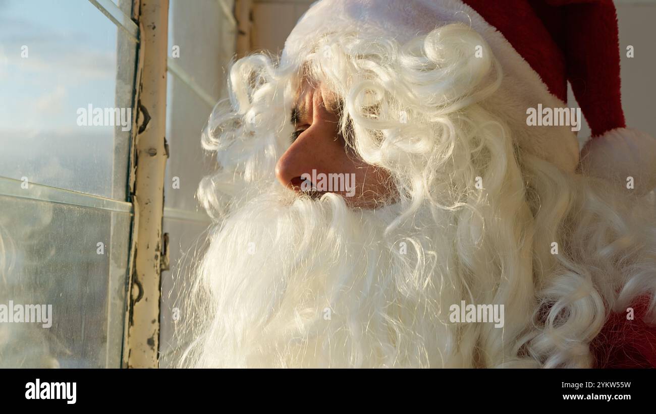 Pensive santa claus watching hi-res stock photography and images - Alamy