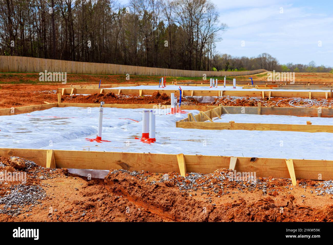 Construction worker prepare foundation of anew building wooden forms ...