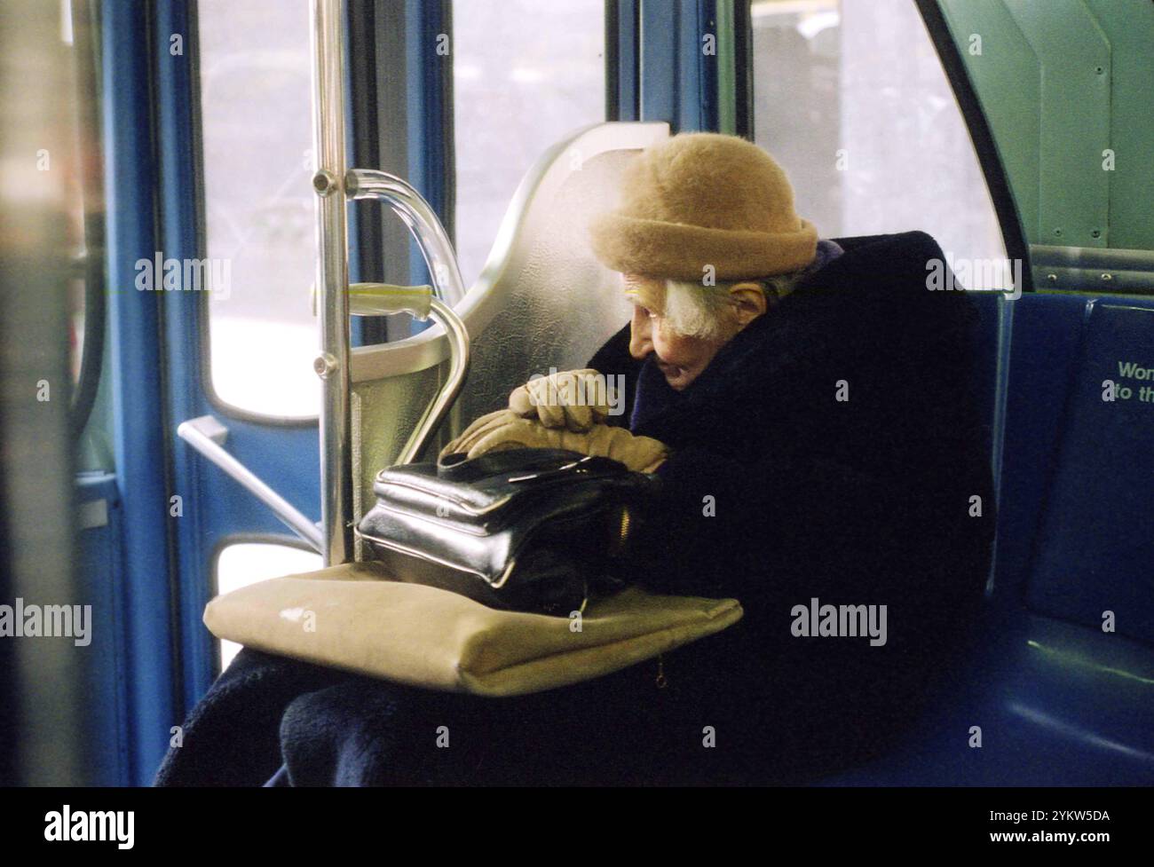 New York City, NY, USA, 1982. Elderly woman riding a public bus in ...