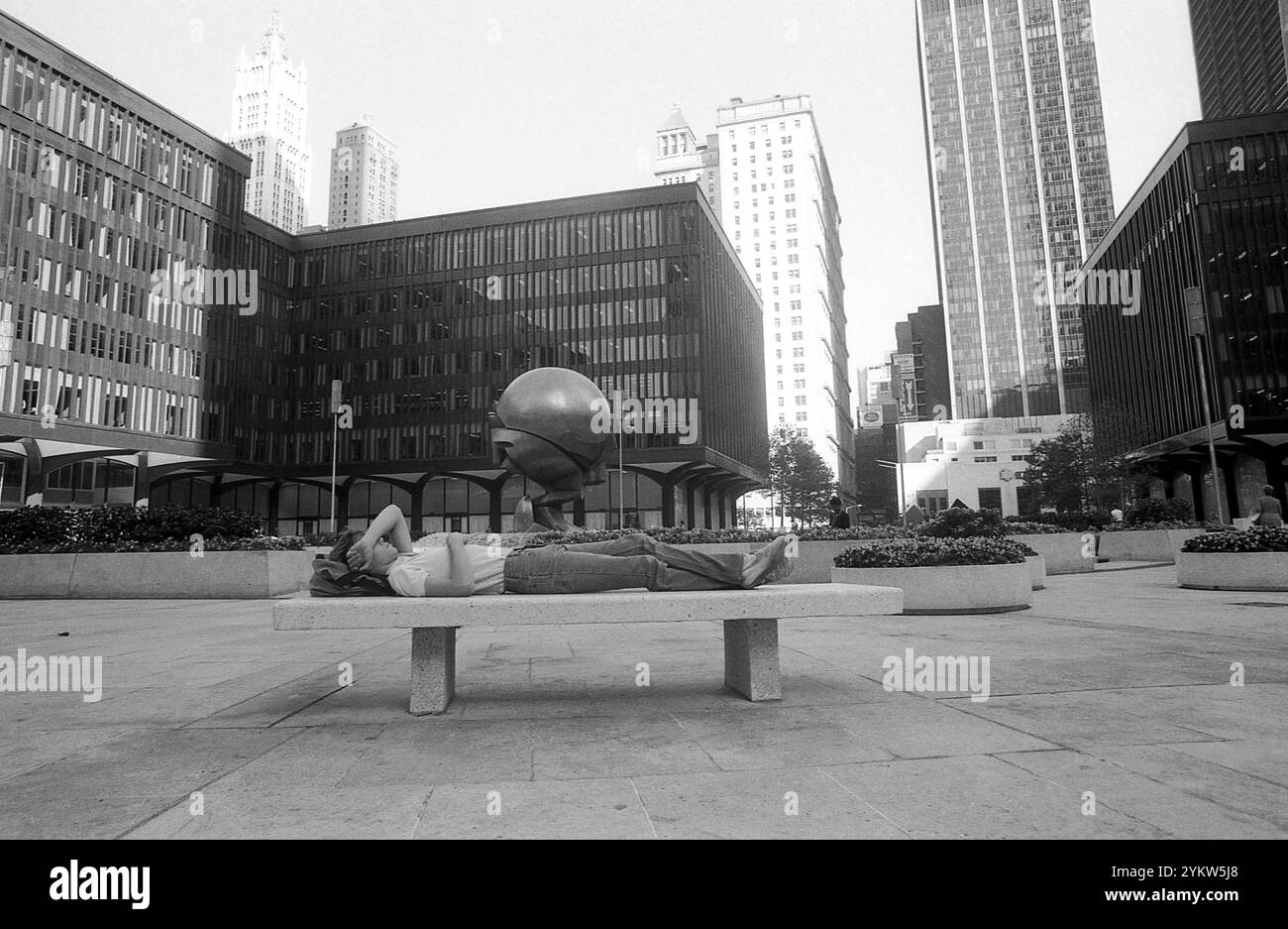 Manhattan, NYC, USA, 1982. Man resting in the World Trade Center Plaza ...