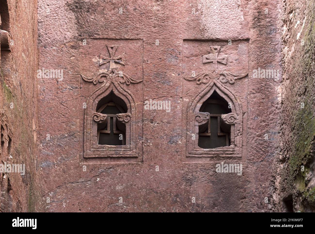 Pointed arch-shaped stone windows on the facade of the rock-hewn church ...