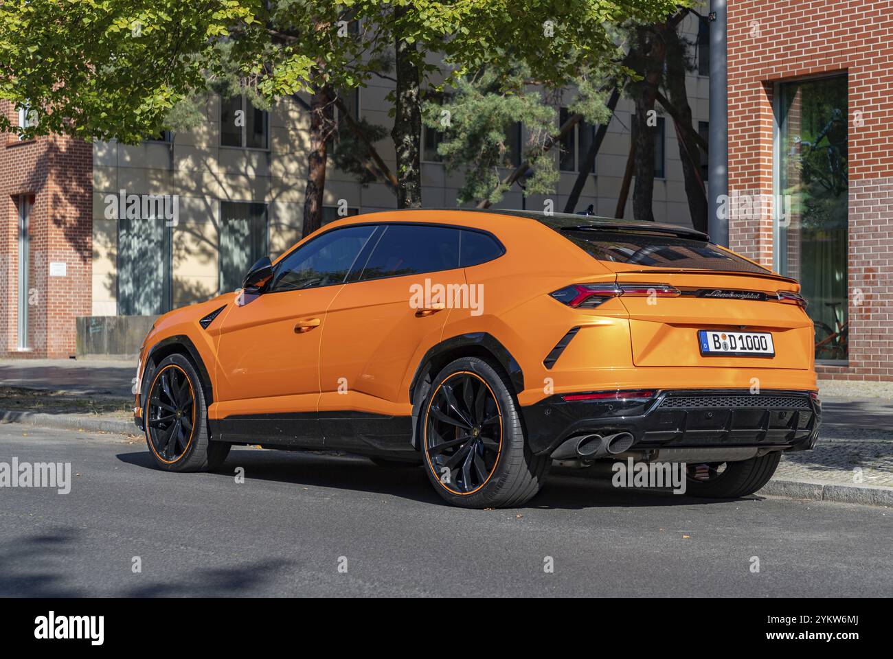 A picture of an orange Lamborghini Urus Stock Photo - Alamy