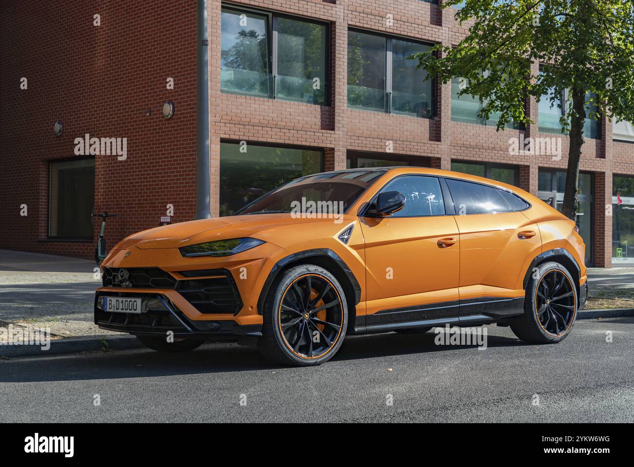 A picture of an orange Lamborghini Urus Stock Photo - Alamy