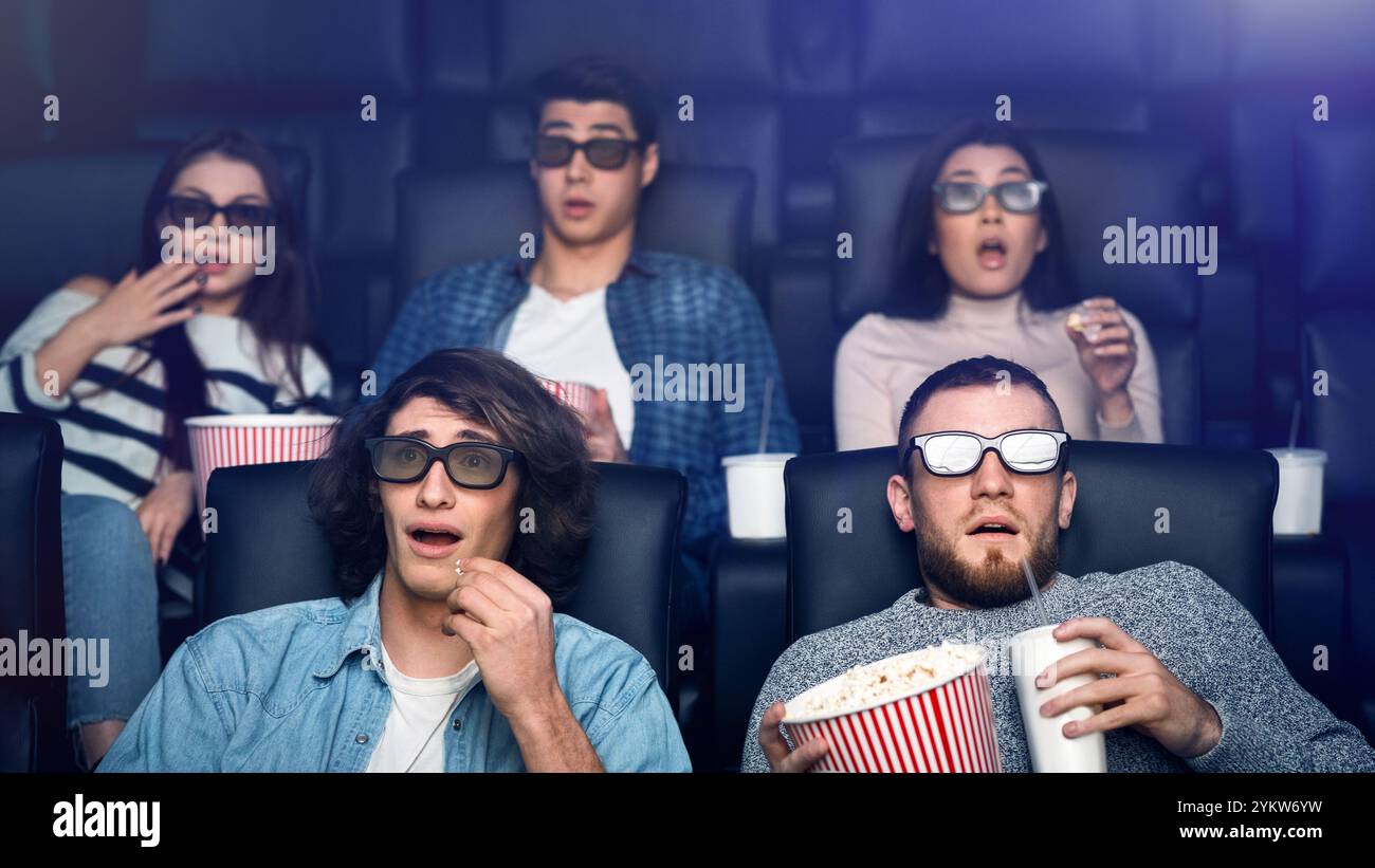 Scared people in 3D glasses watching horror movie in cinema Stock Photo ...