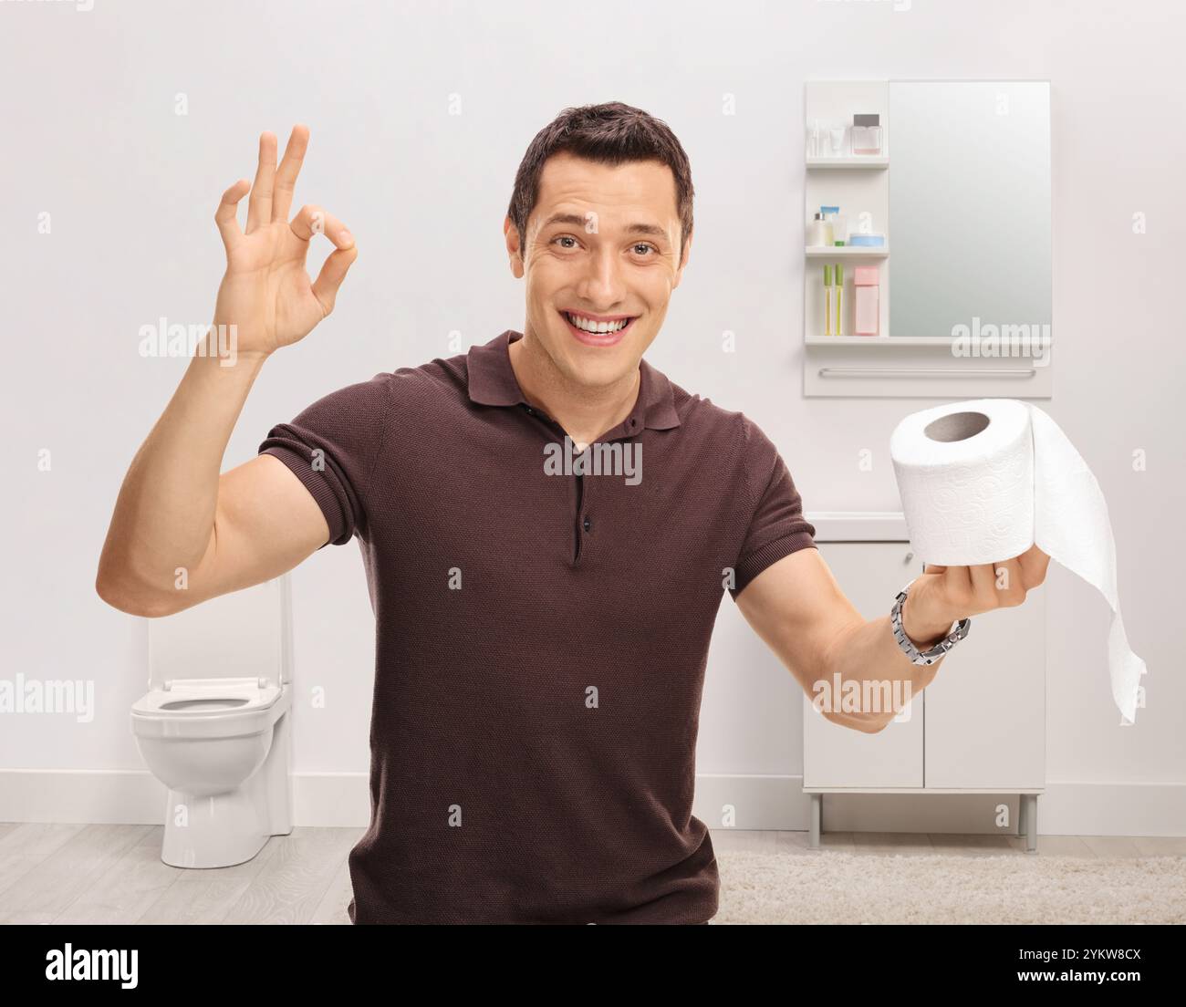 Man hand holding roll toilet hi-res stock photography and images - Alamy