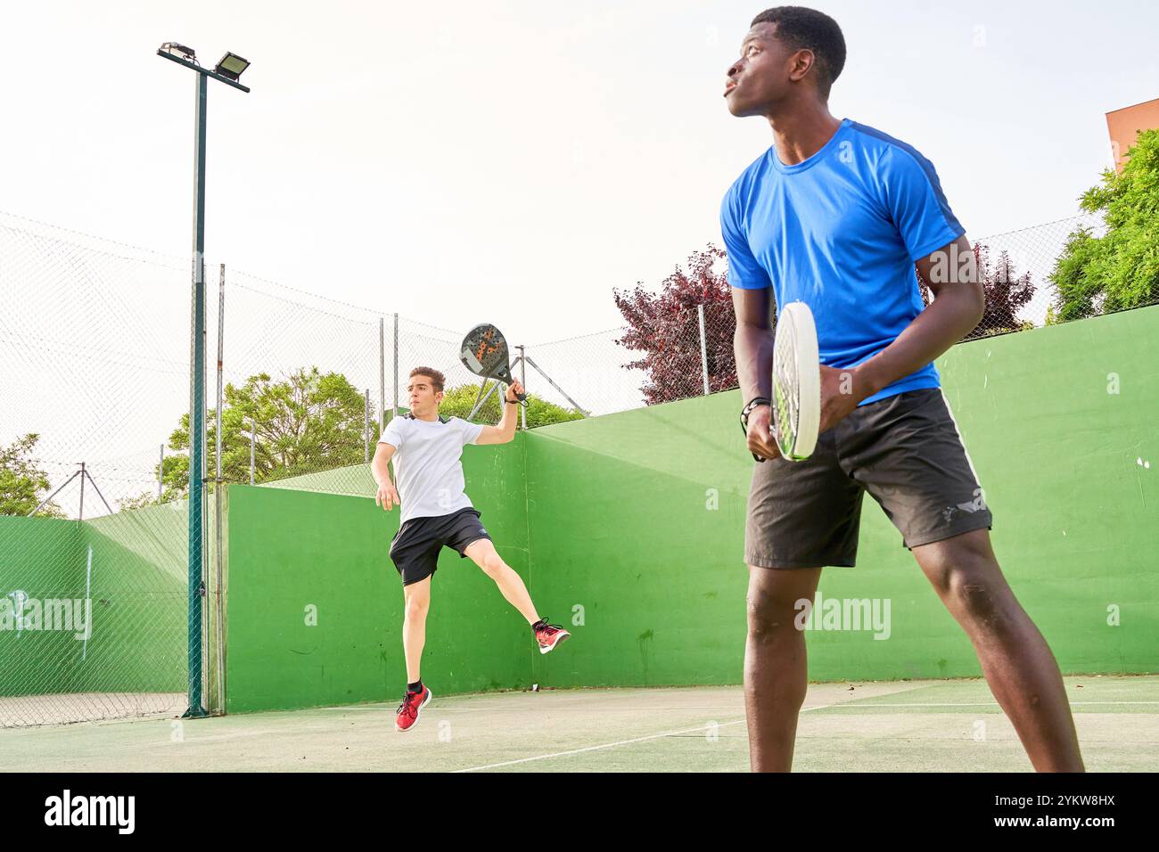 Male friends playing padel hi-res stock photography and images - Alamy