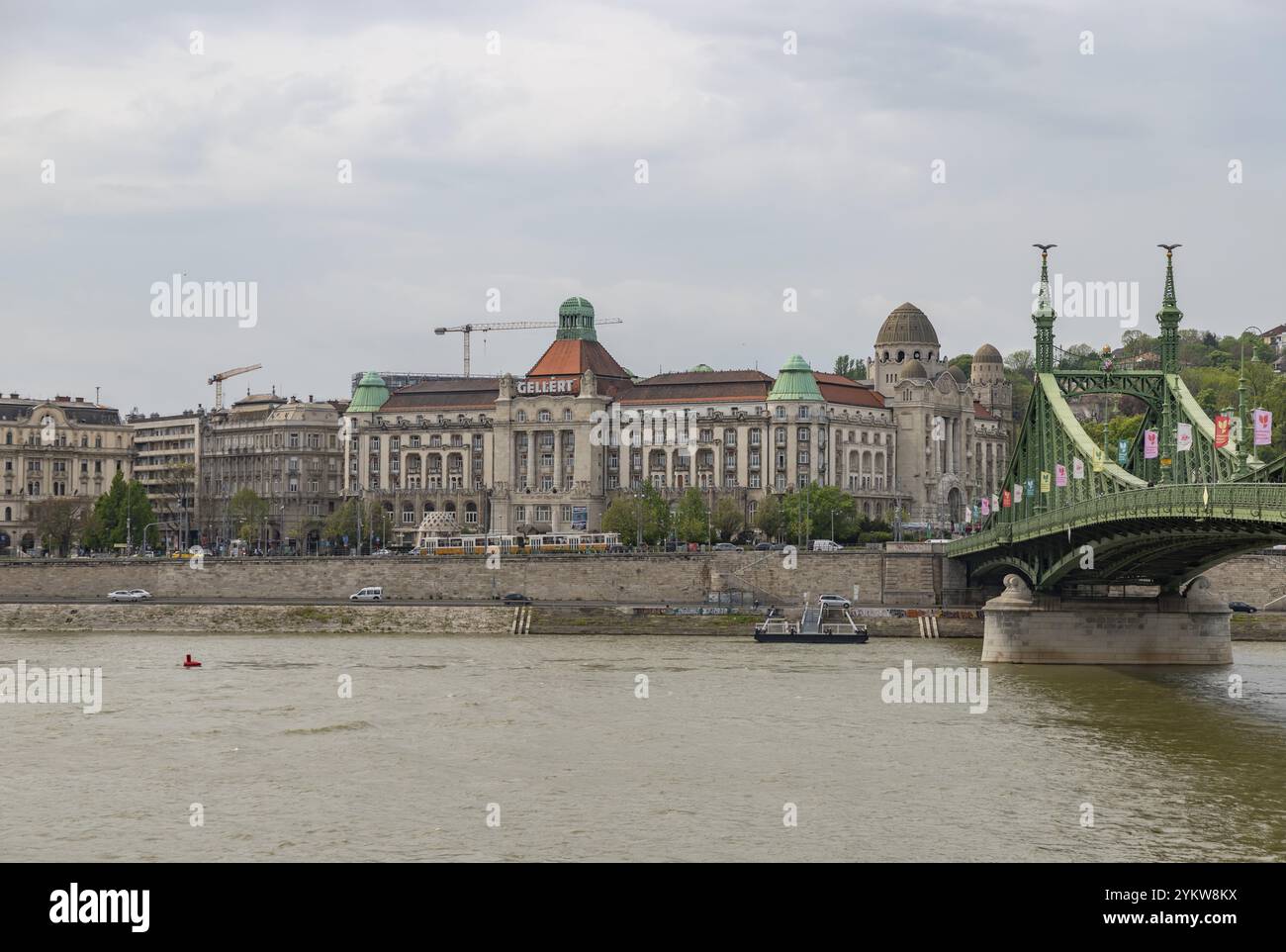 A picture of the Gellert Thermal Bath next to the Liberty Bridge Stock ...