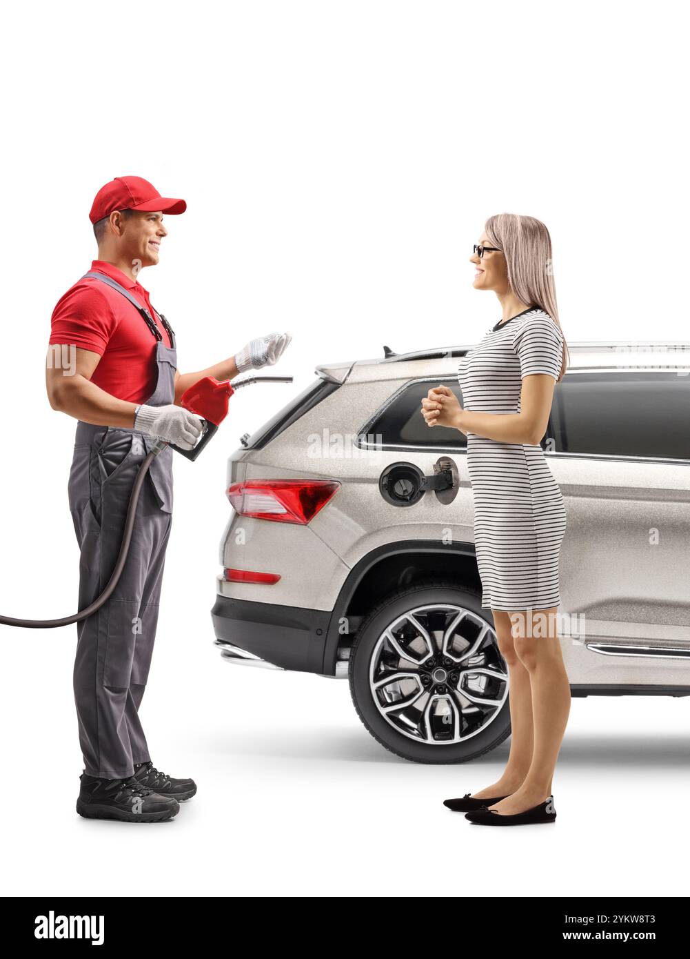 Gas station worker holding a petrol refueling gun and talking to a ... Gas station worker holding a petrol refueling gun and talking to a ...