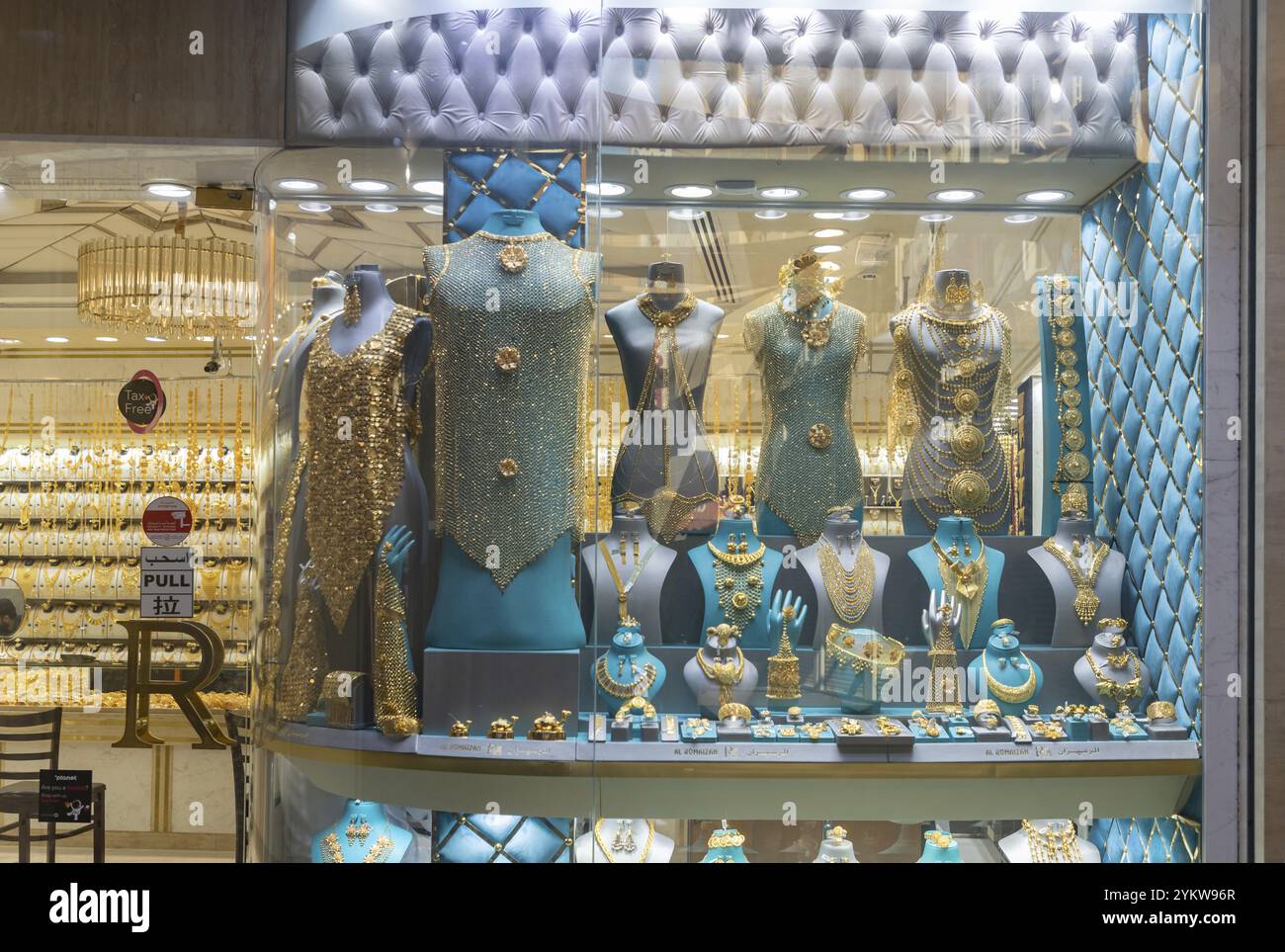 A picture of women's jewelry on a storefront at the Dubai Gold Souk ...
