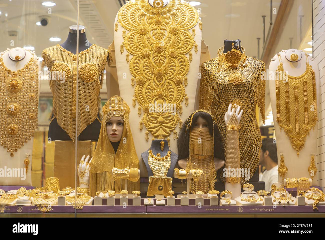 A picture of women's jewelry on a storefront at the Dubai Gold Souk ...