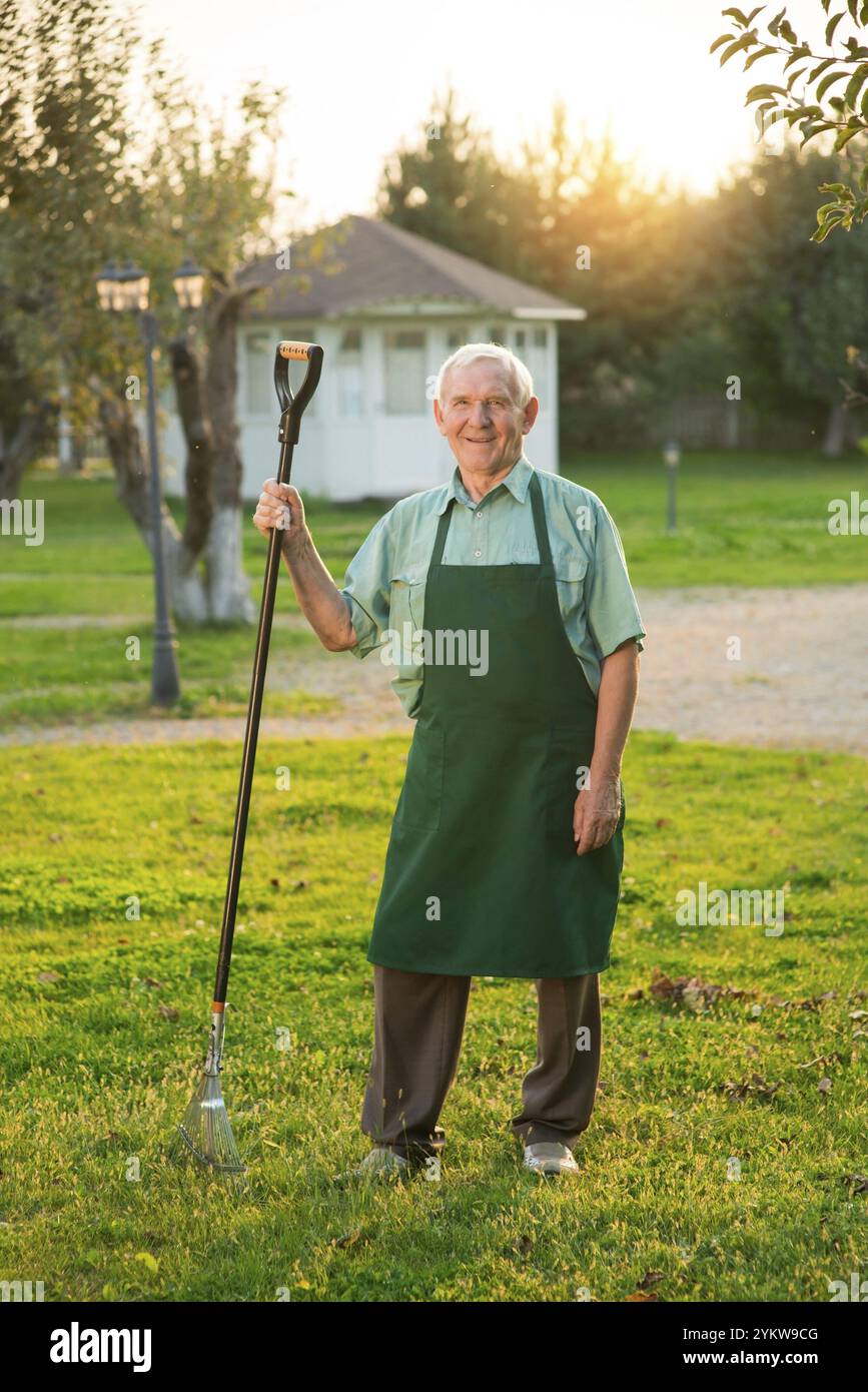 Man standing in grass rake hi-res stock photography and images - Alamy