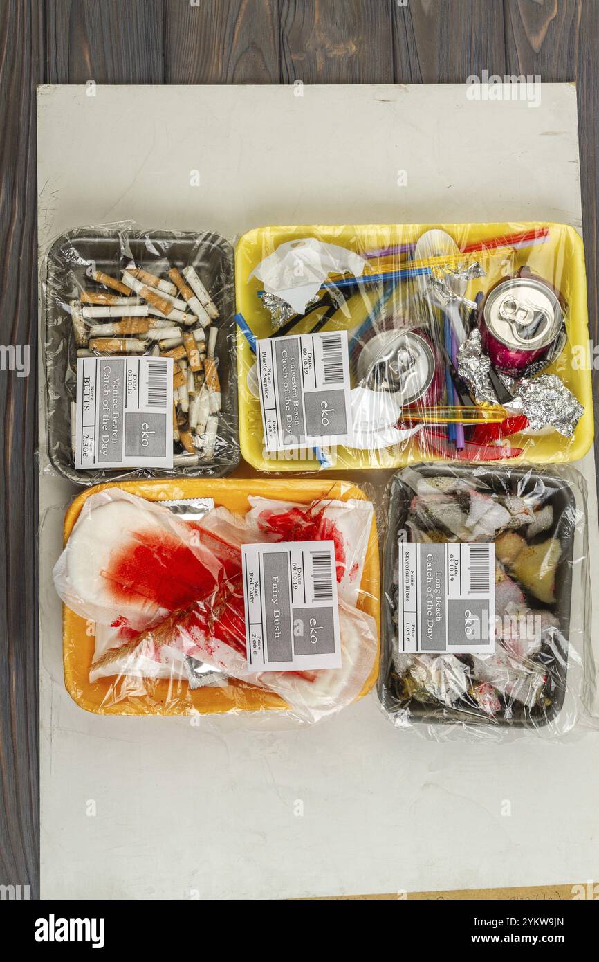 Top view flat lay waste sorting concept. Various types of waste wrapped ...