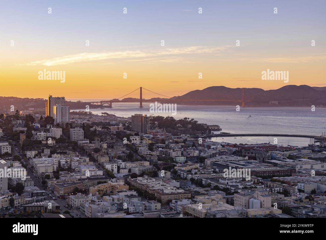 A picture of the Golden Gate Bridge at sunset as seen from the Coit ...