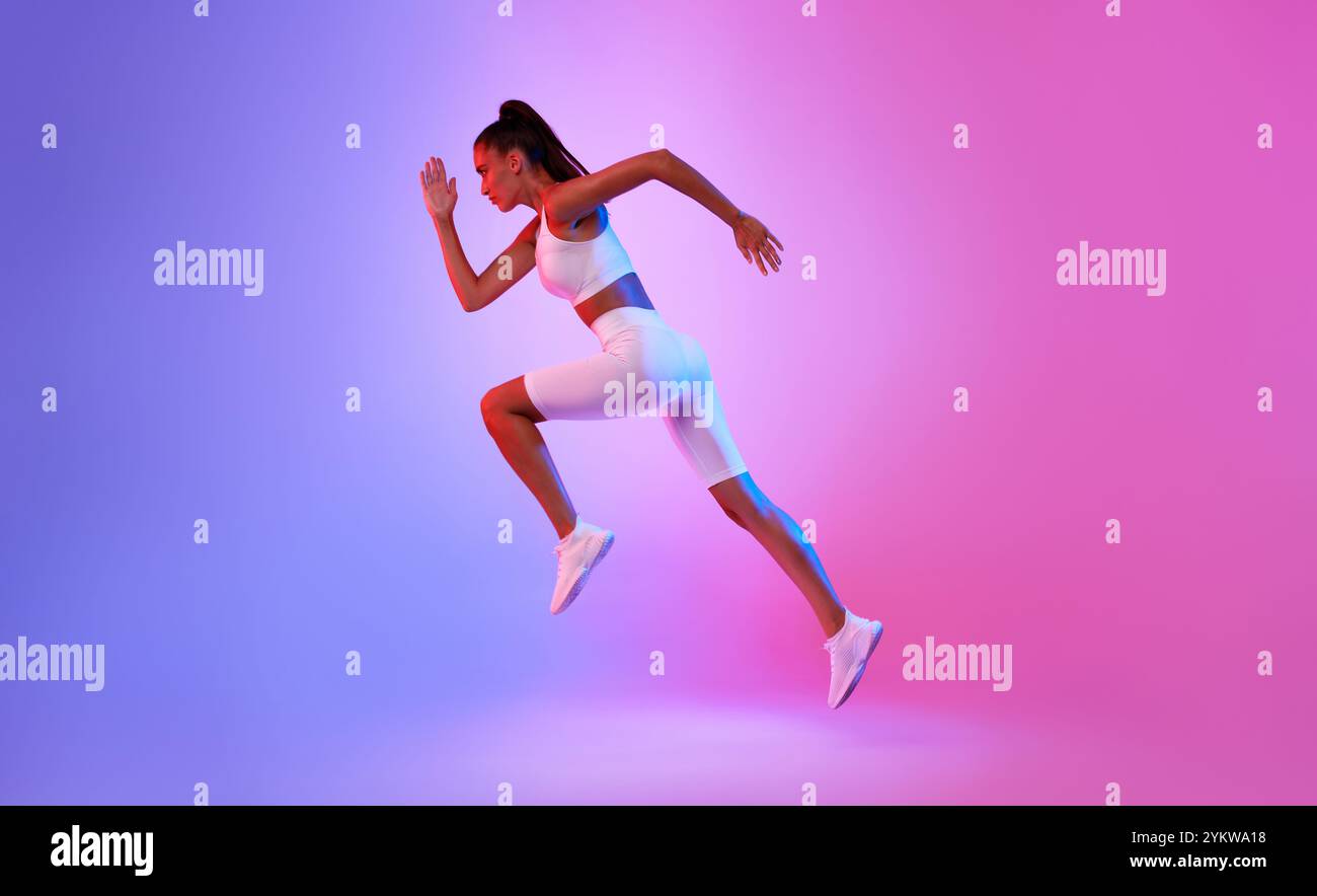 Determined Sporty Woman Running In Mid-Air Over Neon Background, Side ...