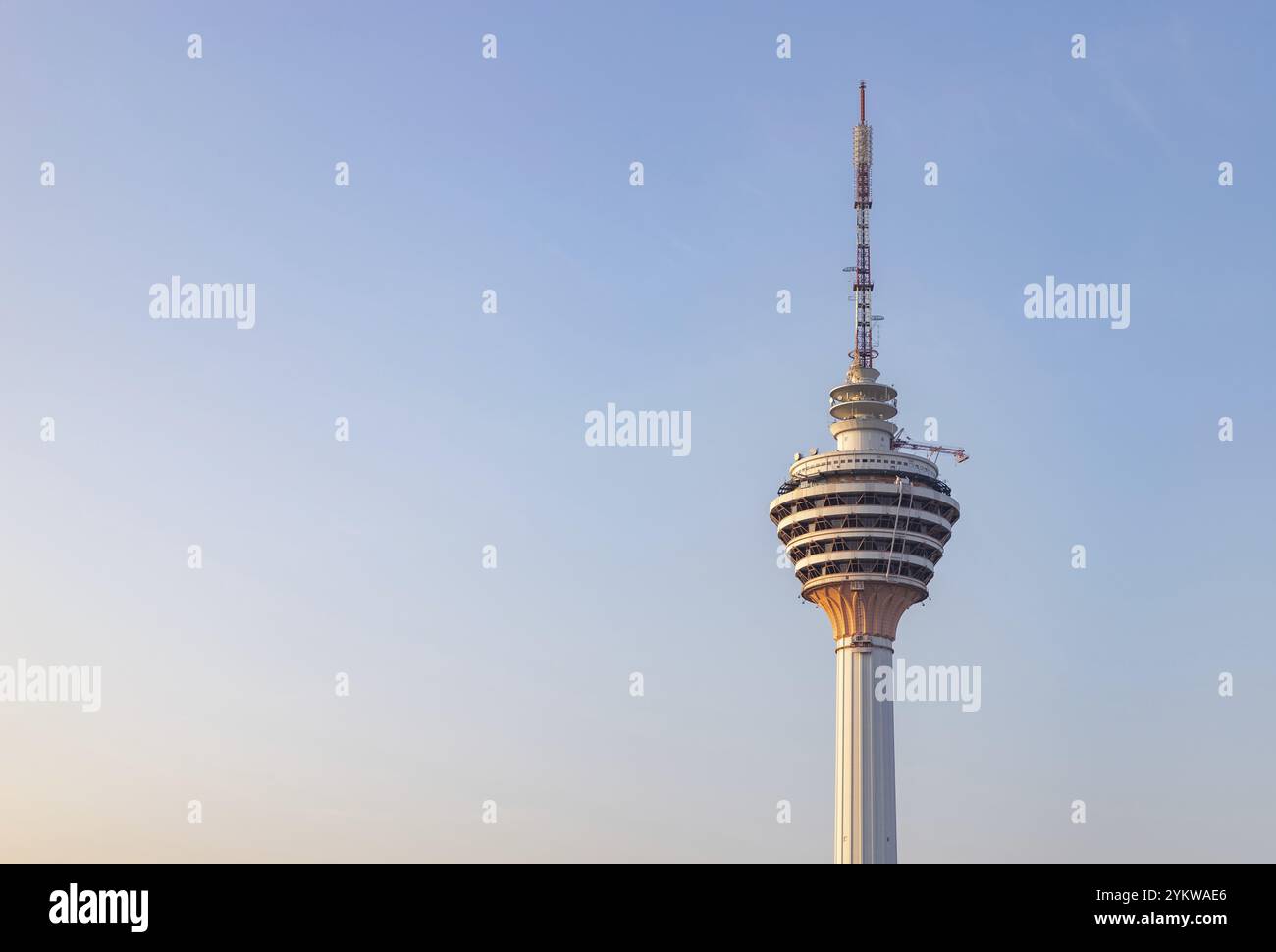 A picture of the upper section of the Menara Kuala Lumpur Tower at dawn ...