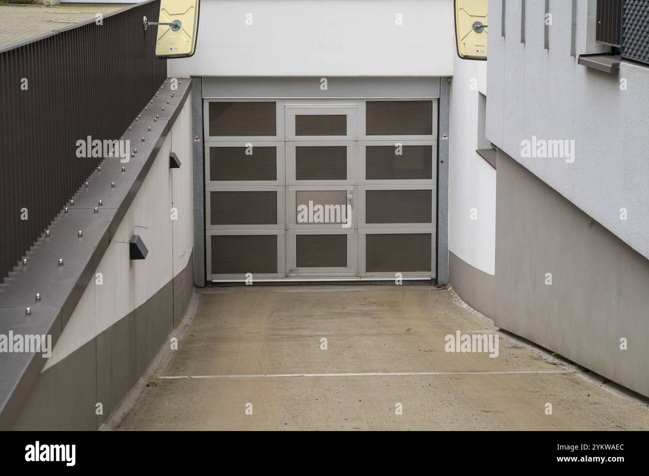 Sectional garage door closing in an underground garage of a modern ...