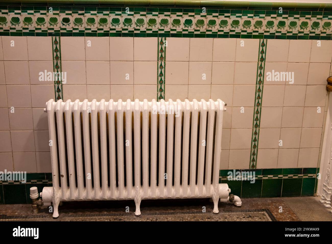 Interior architectural details ornamental tiles and cast iron radiator ...