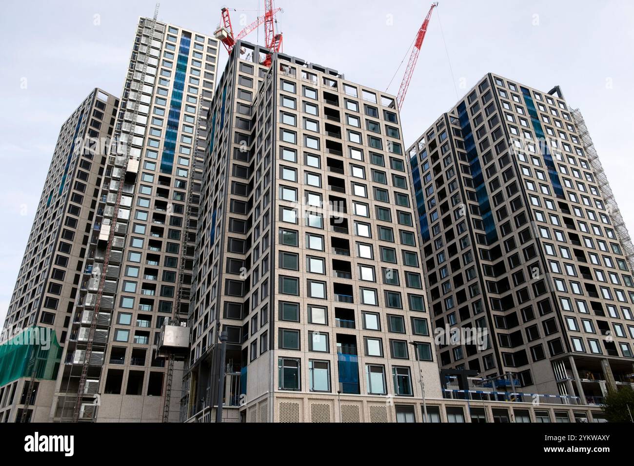 New high rise residential tower blocks under construction with cranes ...