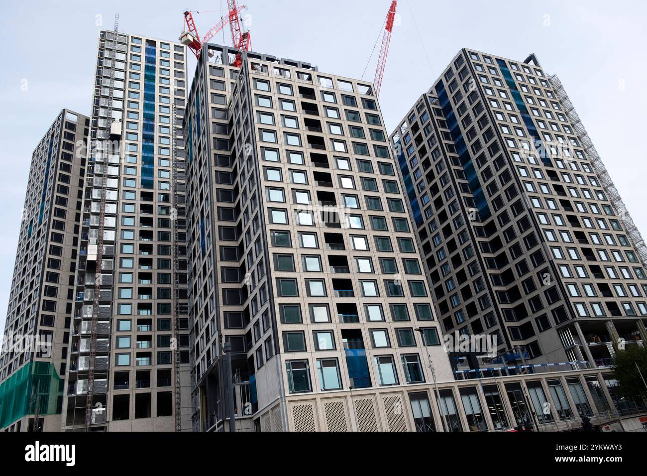 New high rise residential tower blocks under construction with cranes ...